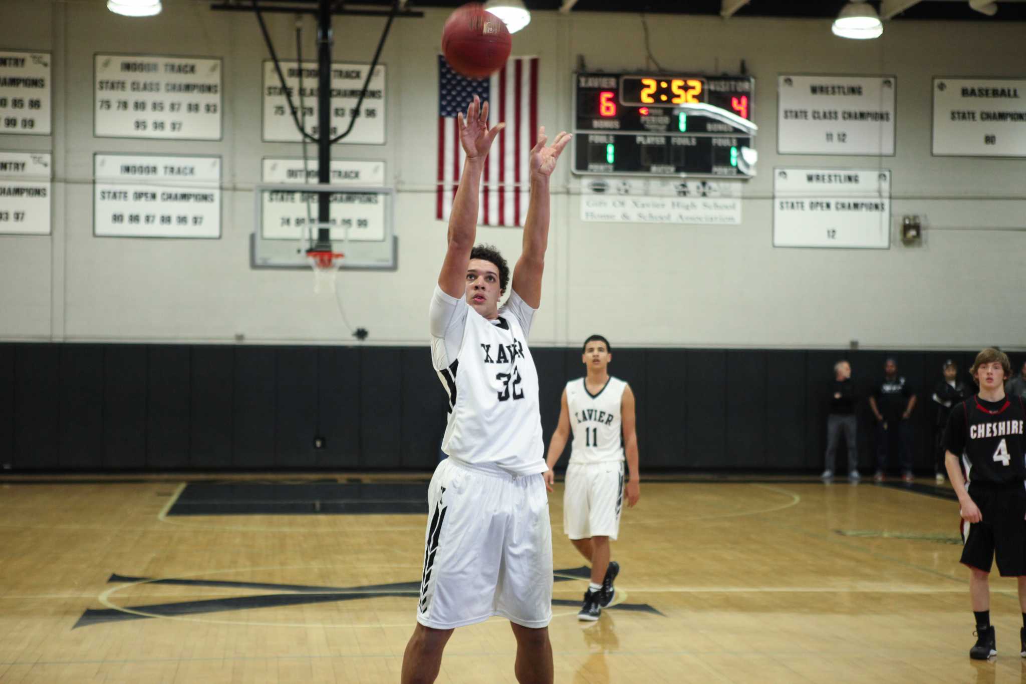 Boys basketball: Xavier's Lutton leading by example