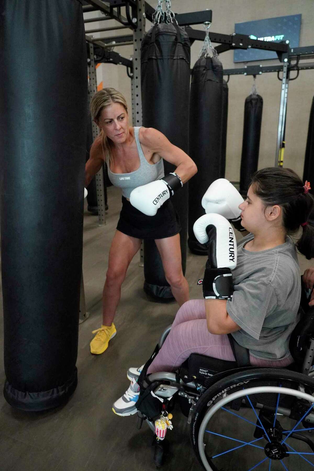 Workouts give Houston mom and paralyzed daughter physical and emotional ...