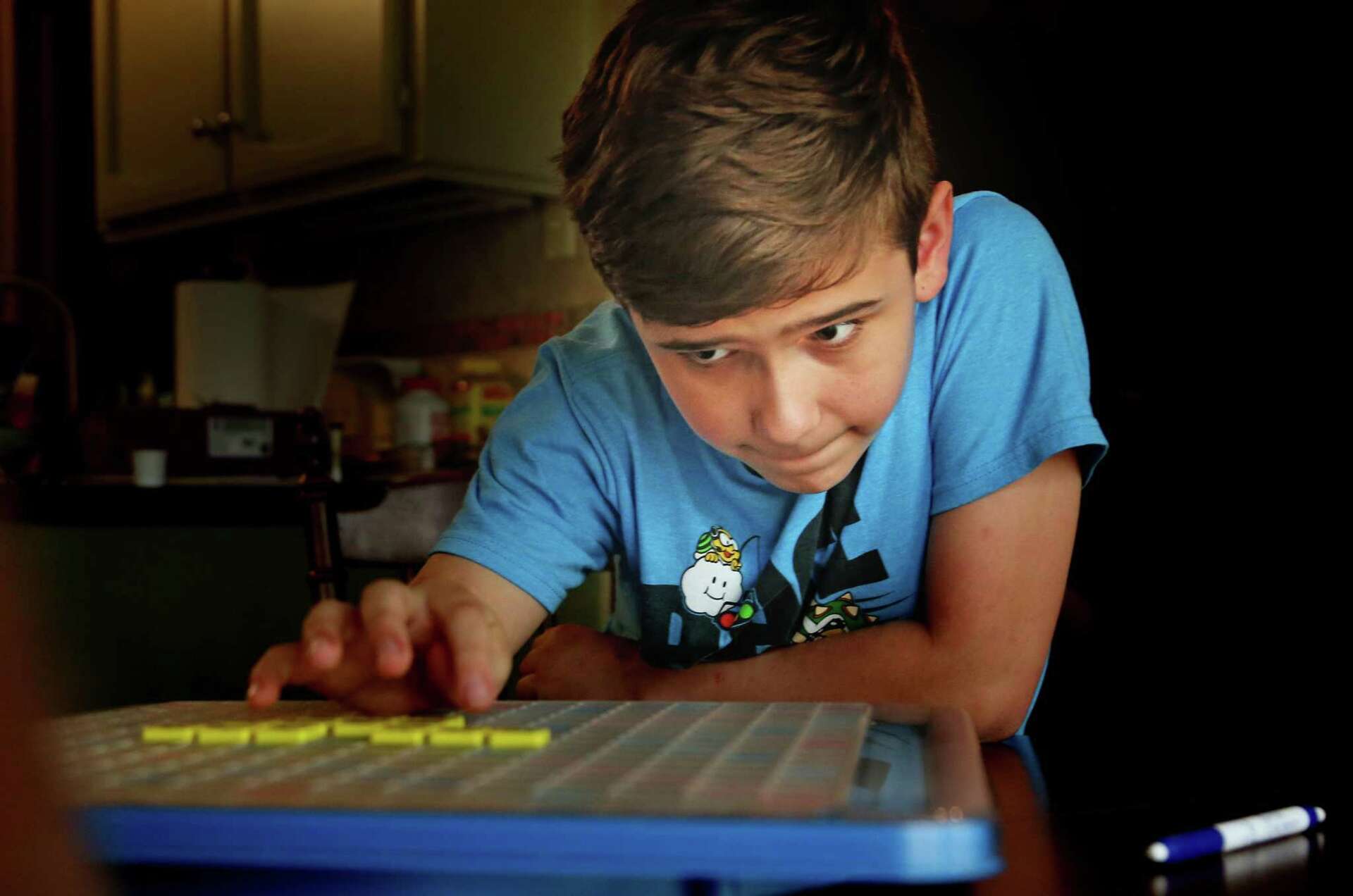 Scrabble star in two languages, S.A. boy with autism finds peace