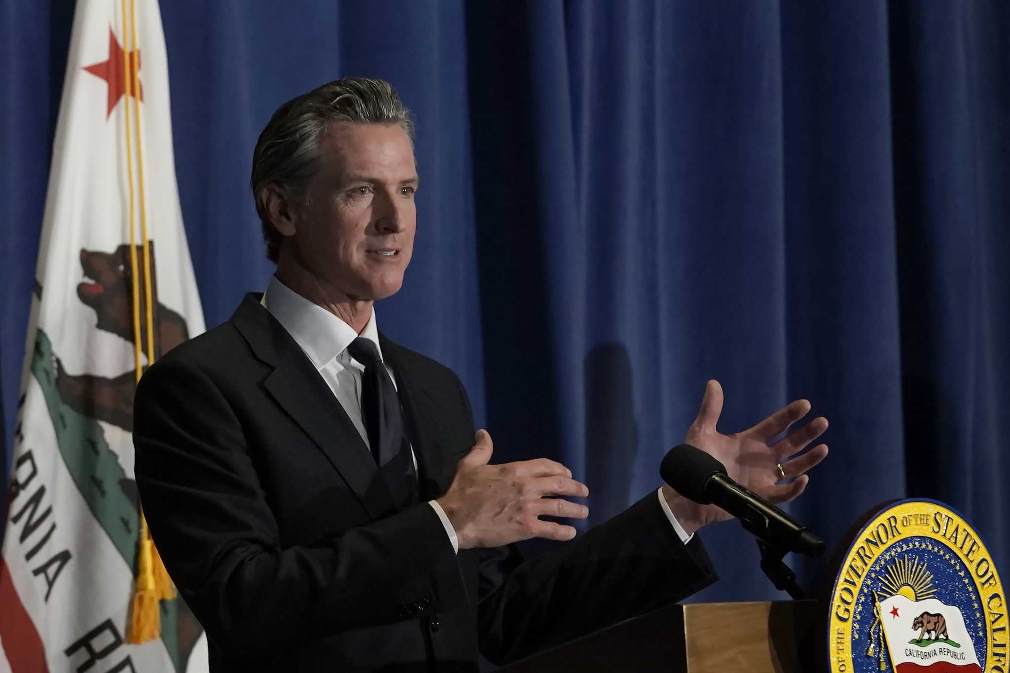Newsom calls Abbott's attacks 'crap,' vows to sign 12 new gun bills