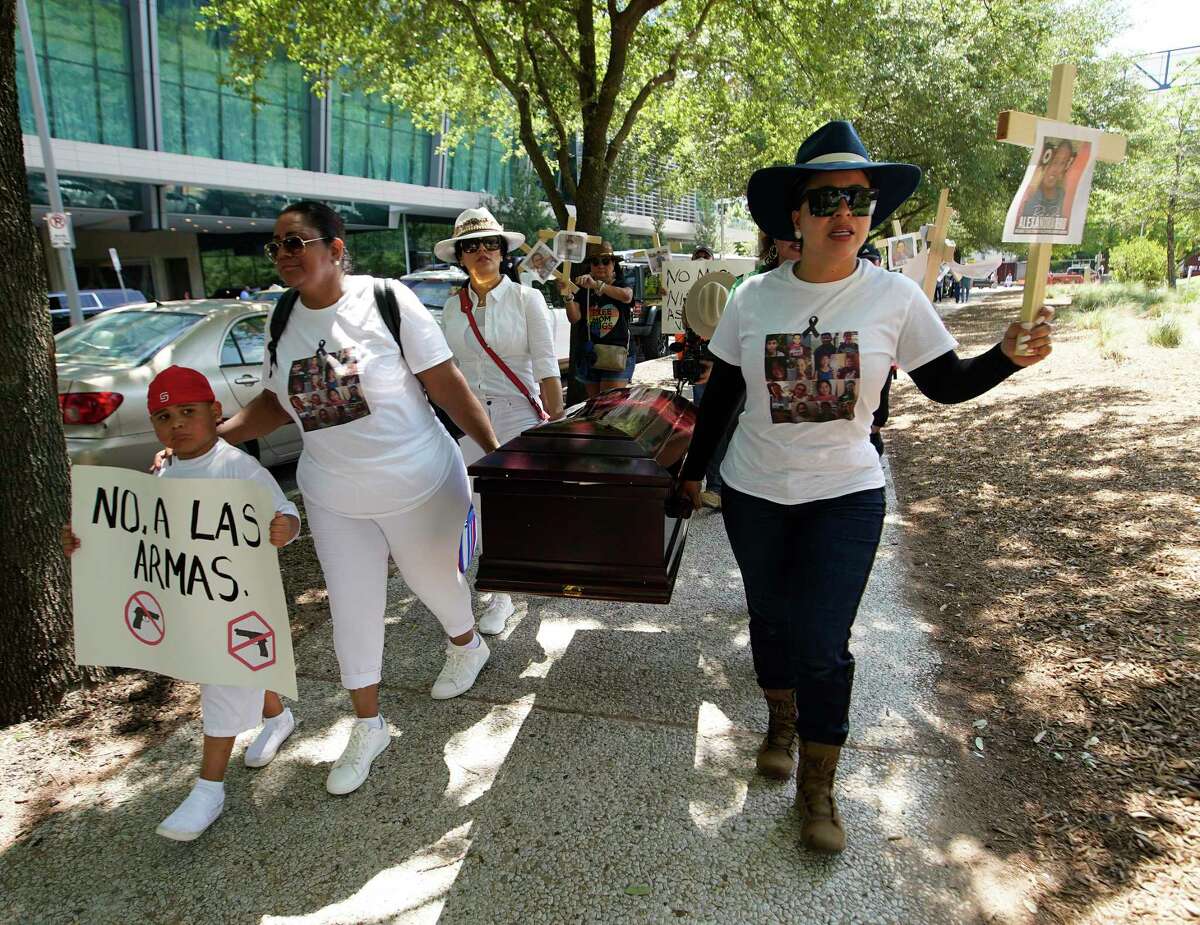 Houston NRA convention draws protesters at Discovery Green