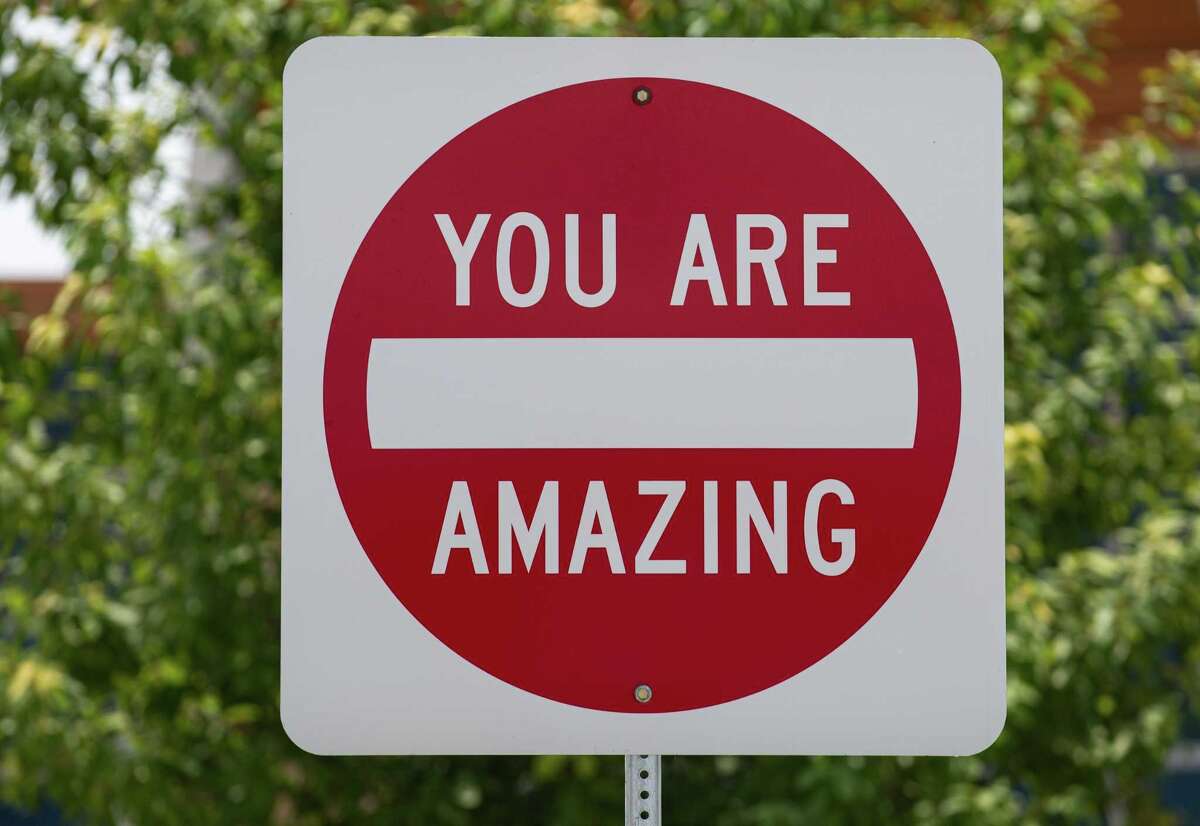 Artistic street signs in Houston suburb display positive messages