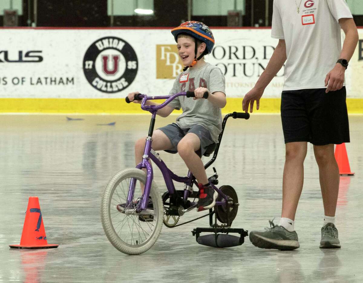 Children with disabilities who had to give up bikes years ago mastered ...