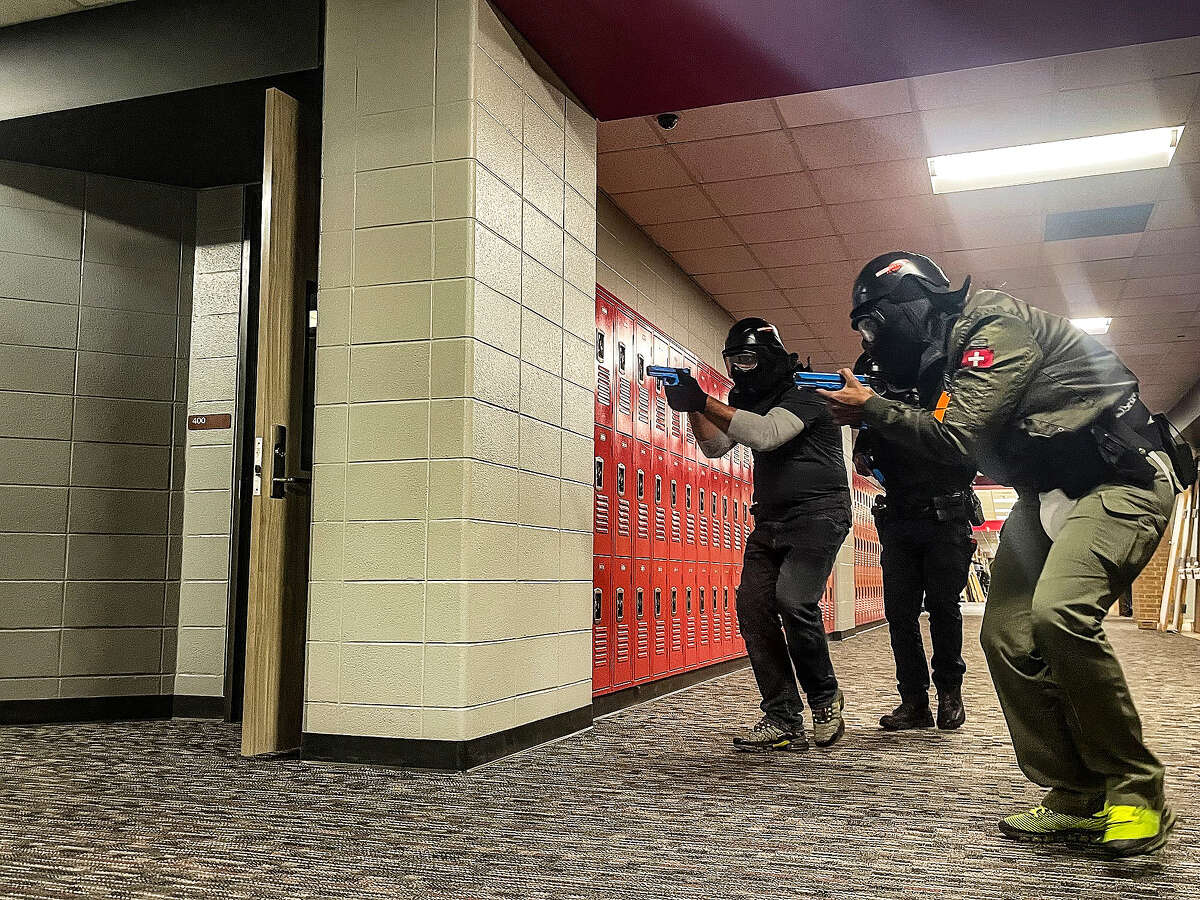 Signs outside Texas schools warn staffers inside may be armed