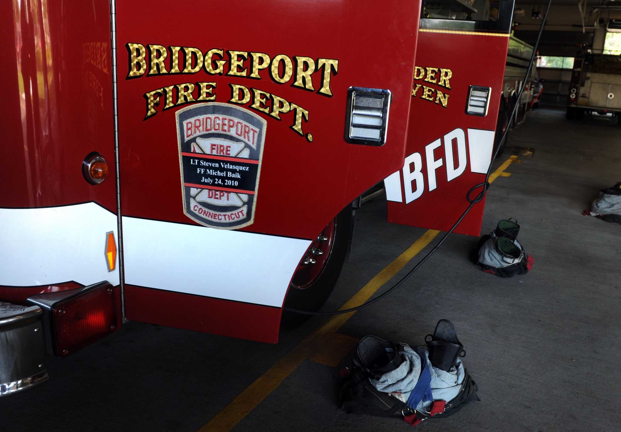 Bridgeport firefighter falls through floor in building fire