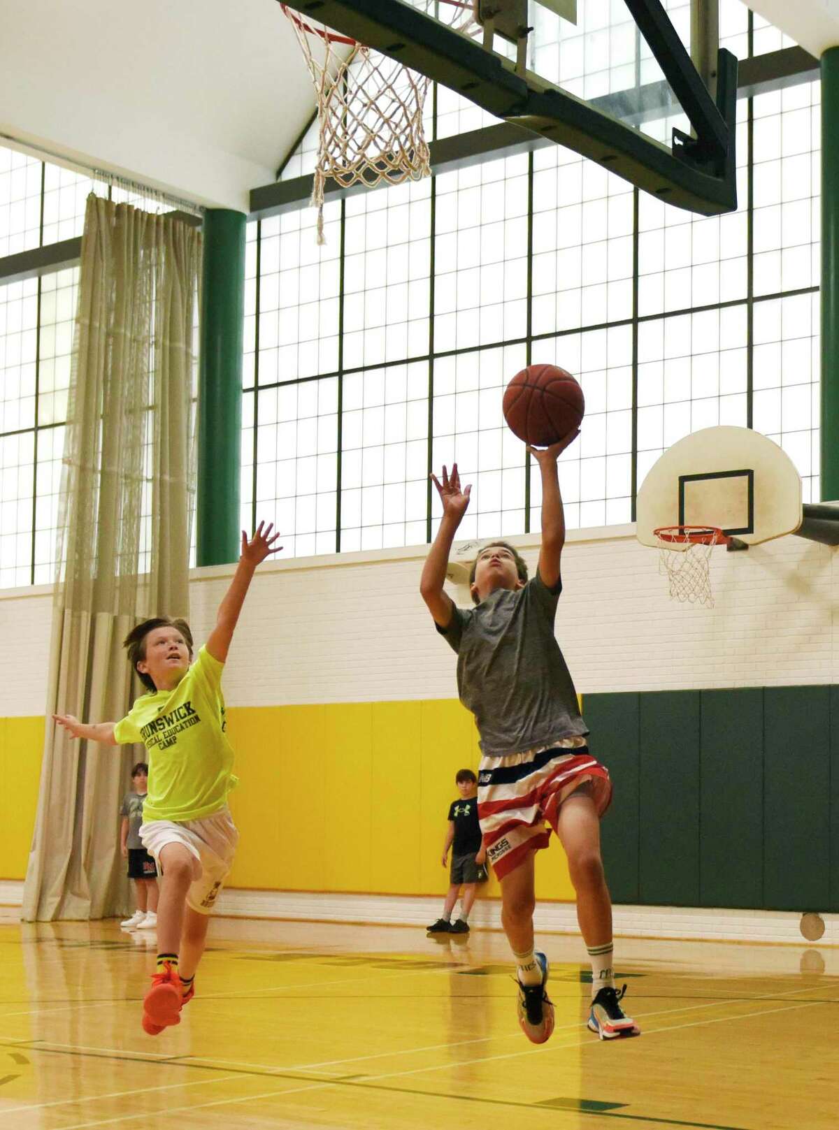 Greenwich kids hit the court at summer basketball camp held at Eagle Hill