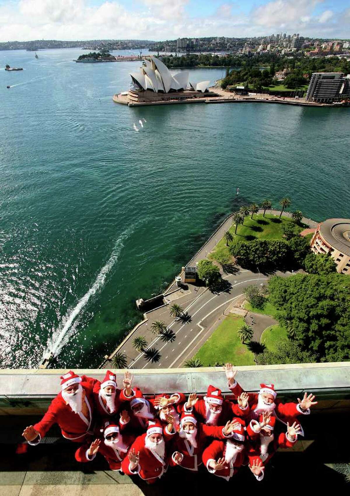 Santas Climb Sydney Harbour Bridge for Santa Fun Run