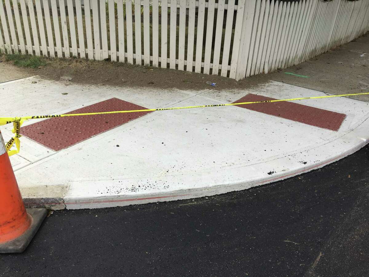 Uncut curbs on Front Street in Fair Haven meant to calm traffic