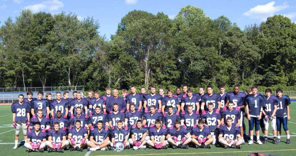 Staples football players 'in the pink' -- for a cause
