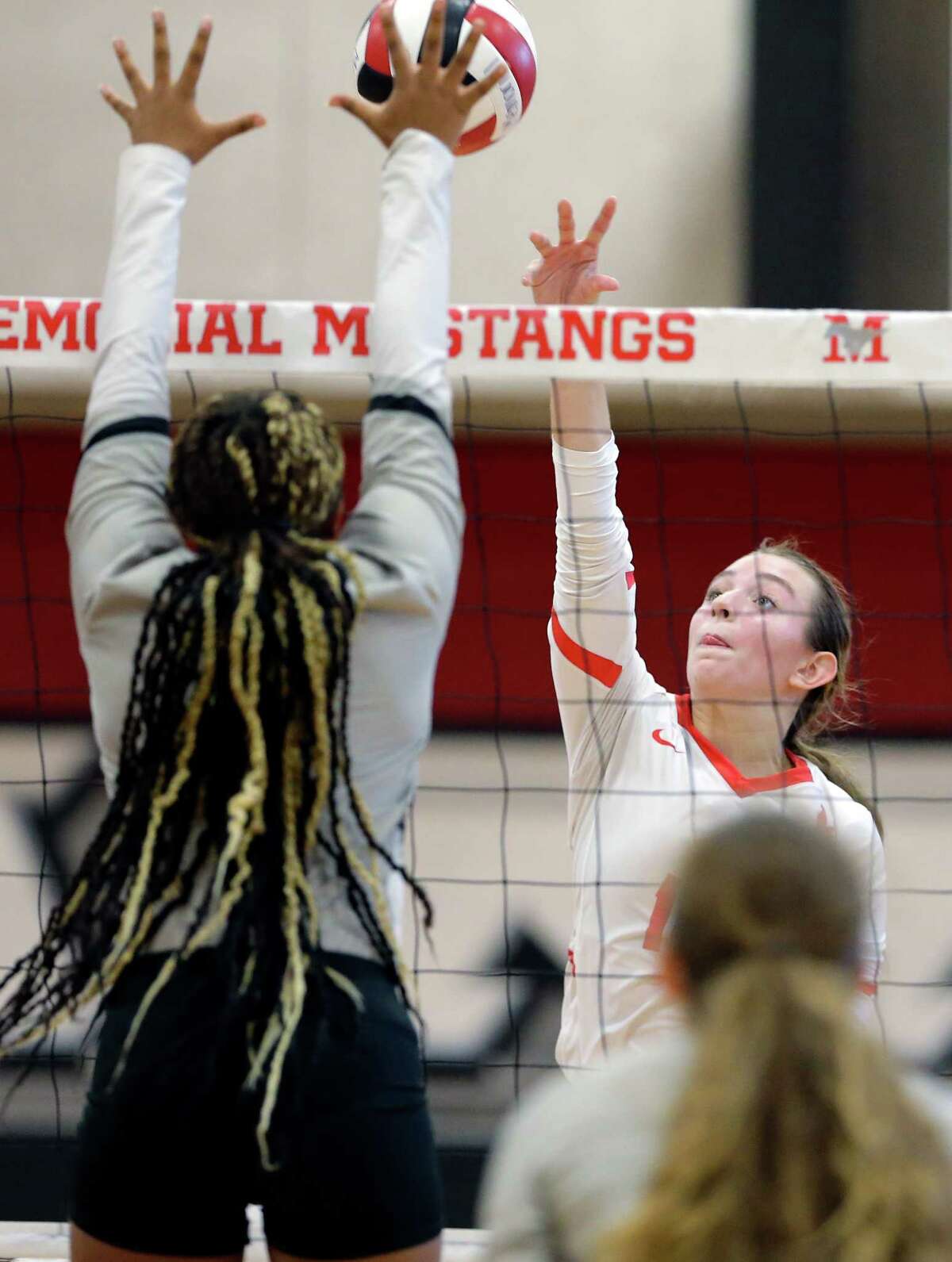 High school volleyball: Foster downs Memorial in four sets