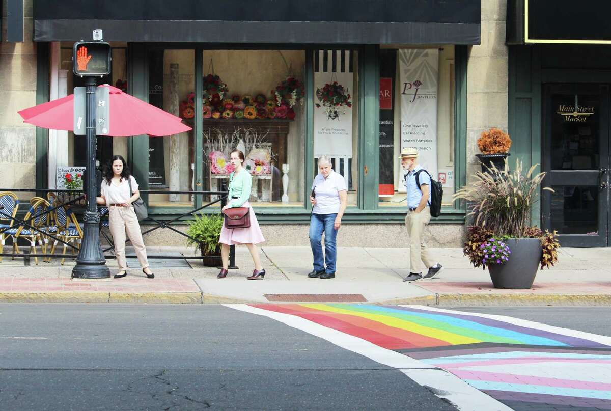 Some question wait to walk at Middletown intersection