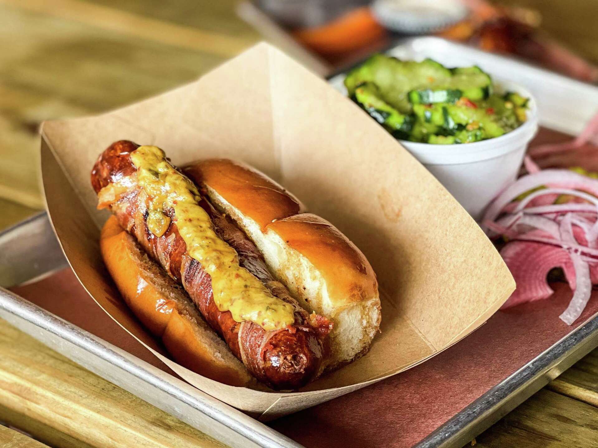 Hot dogs are finding a home on Texas barbecue-joint menus