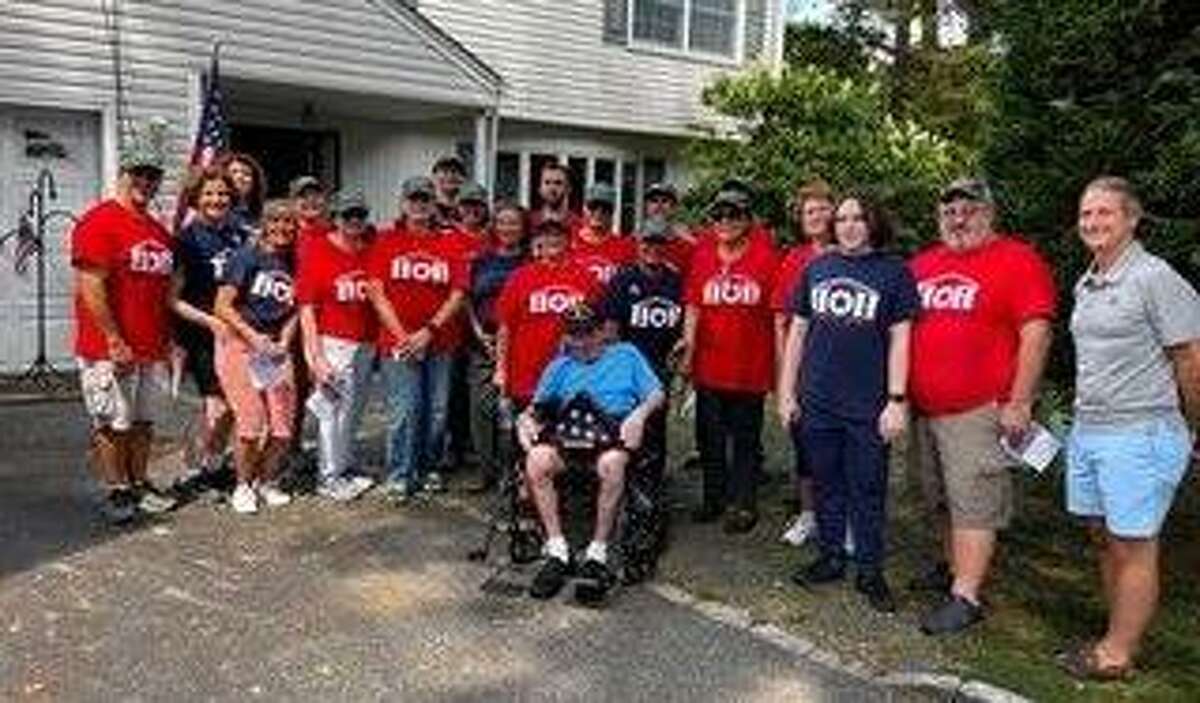 Crew from Greenwich Hospital helps repair home of Vietnam vet