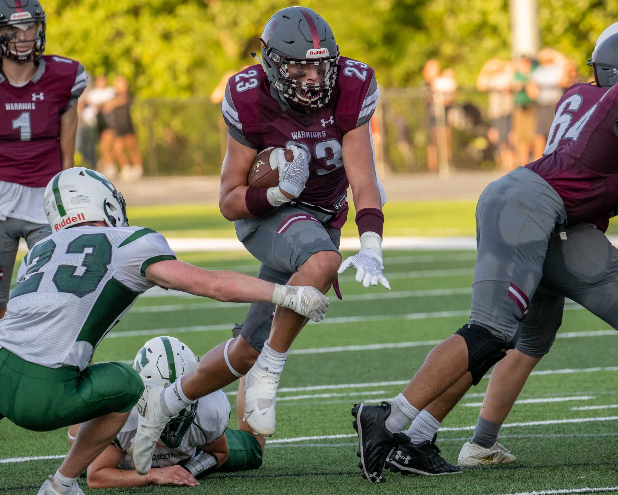 Mueller after a title in senior football season with Stillwater