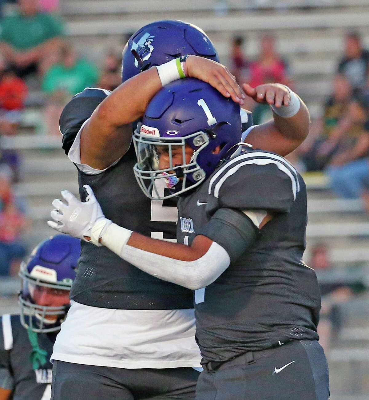 High school football: Warren 63, Holmes 0