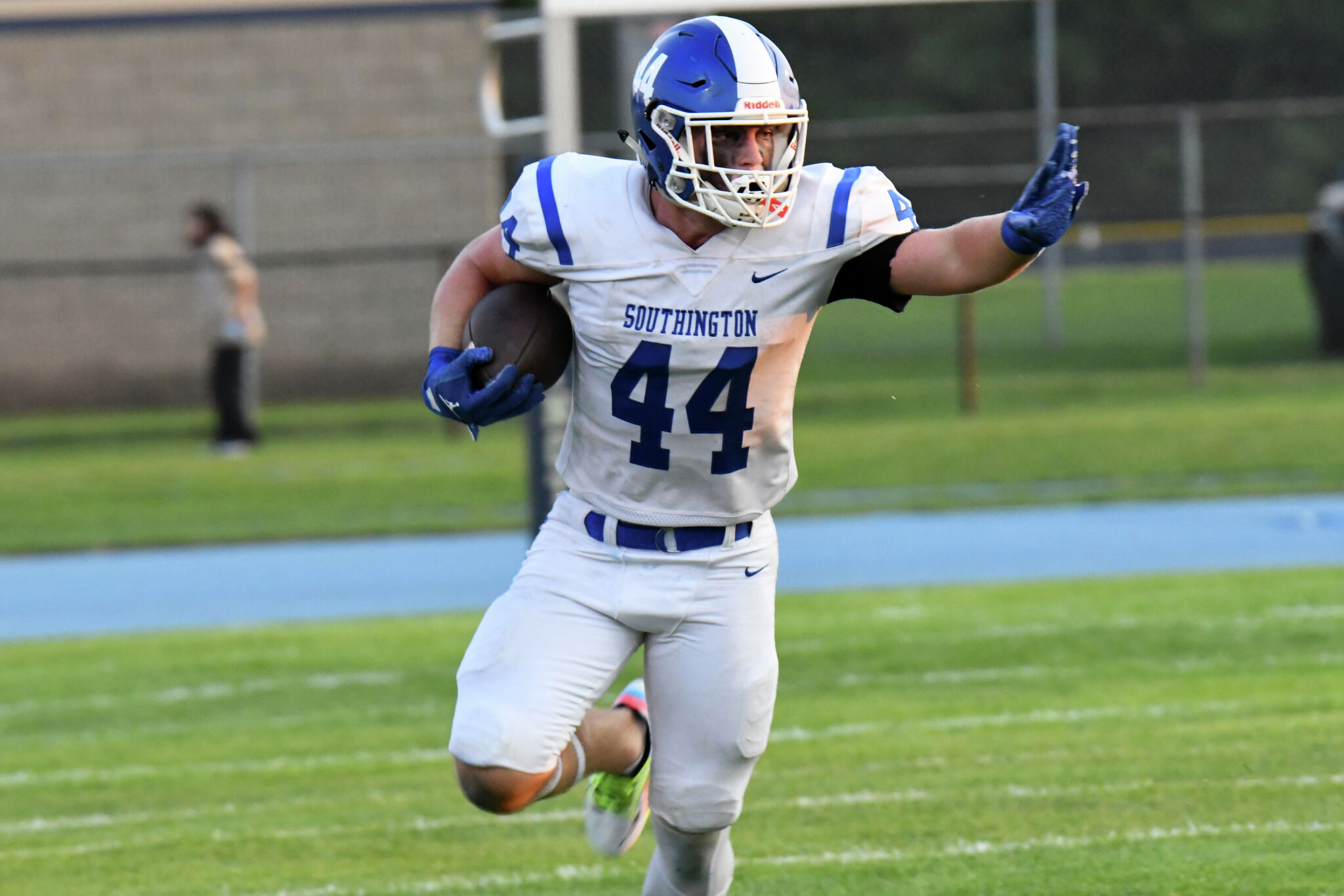 Southington football's Lincoln Cardillo runs, catches, kicks