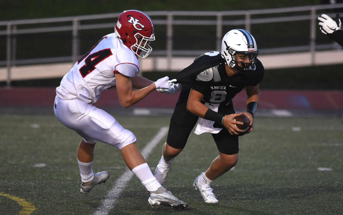 New Canaan football had four TDs from Hunter Telesco in a shutout of Xavier