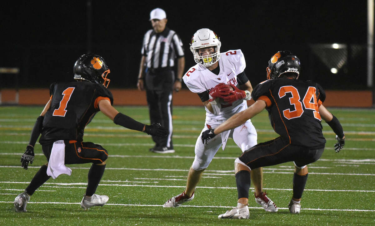 Top-ranked Greenwich football overcame Ridgefield in FCIAC game