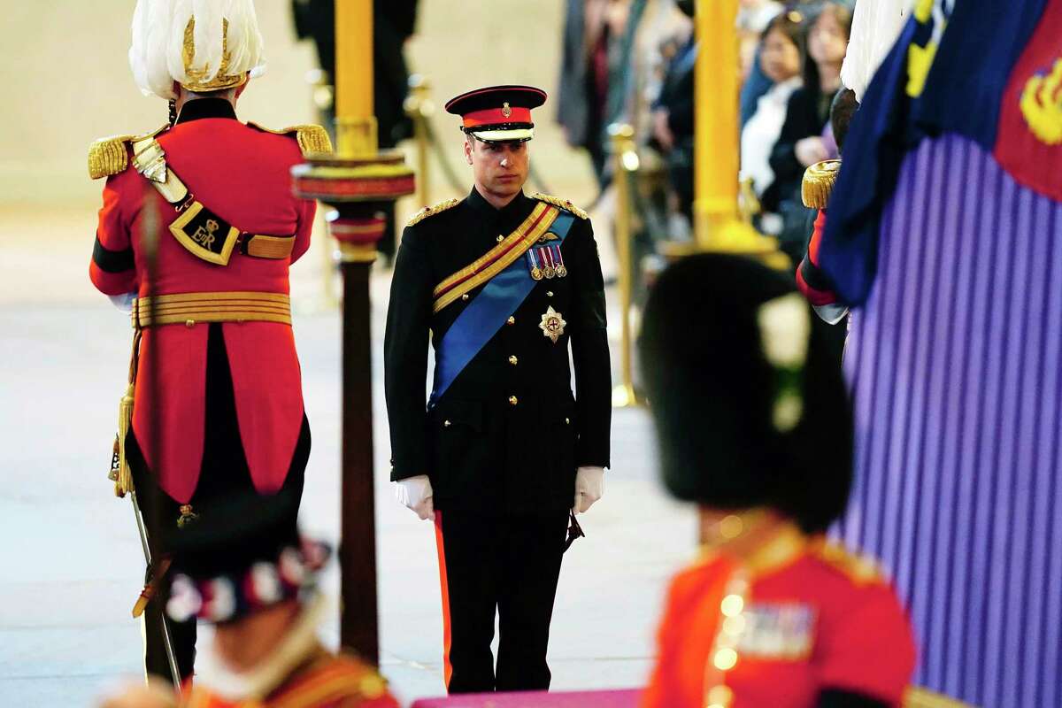 Princes William and Harry hold silent vigil beside Queen Elizabeth II's ...