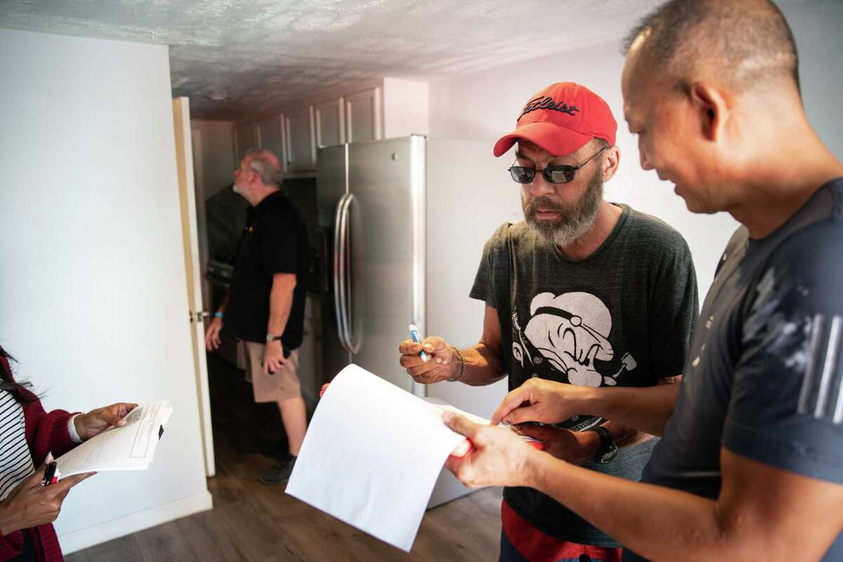 Houston friends move from encampment to quiet apartments