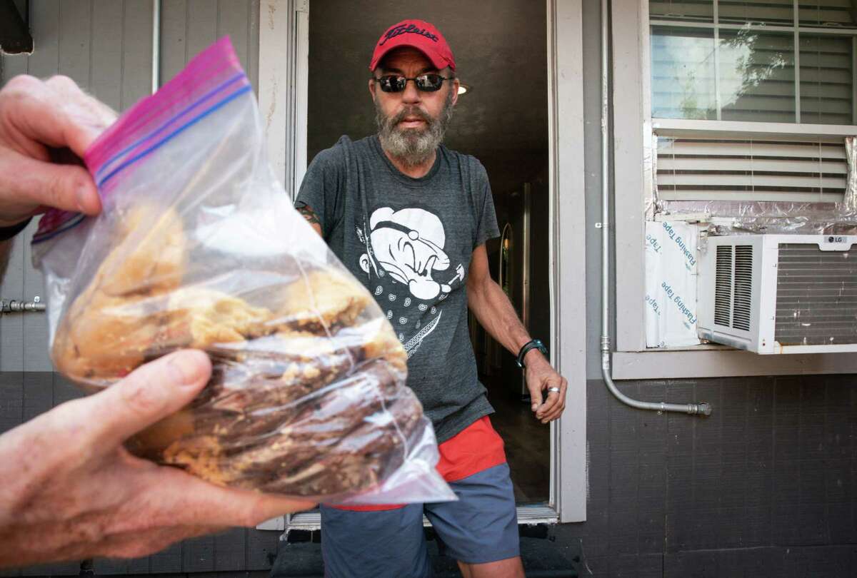 Houston friends move from encampment to quiet apartments