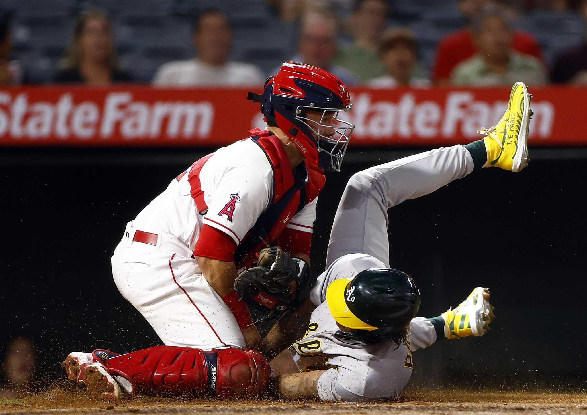 Angels score in 8th to hand A’s their 98th loss