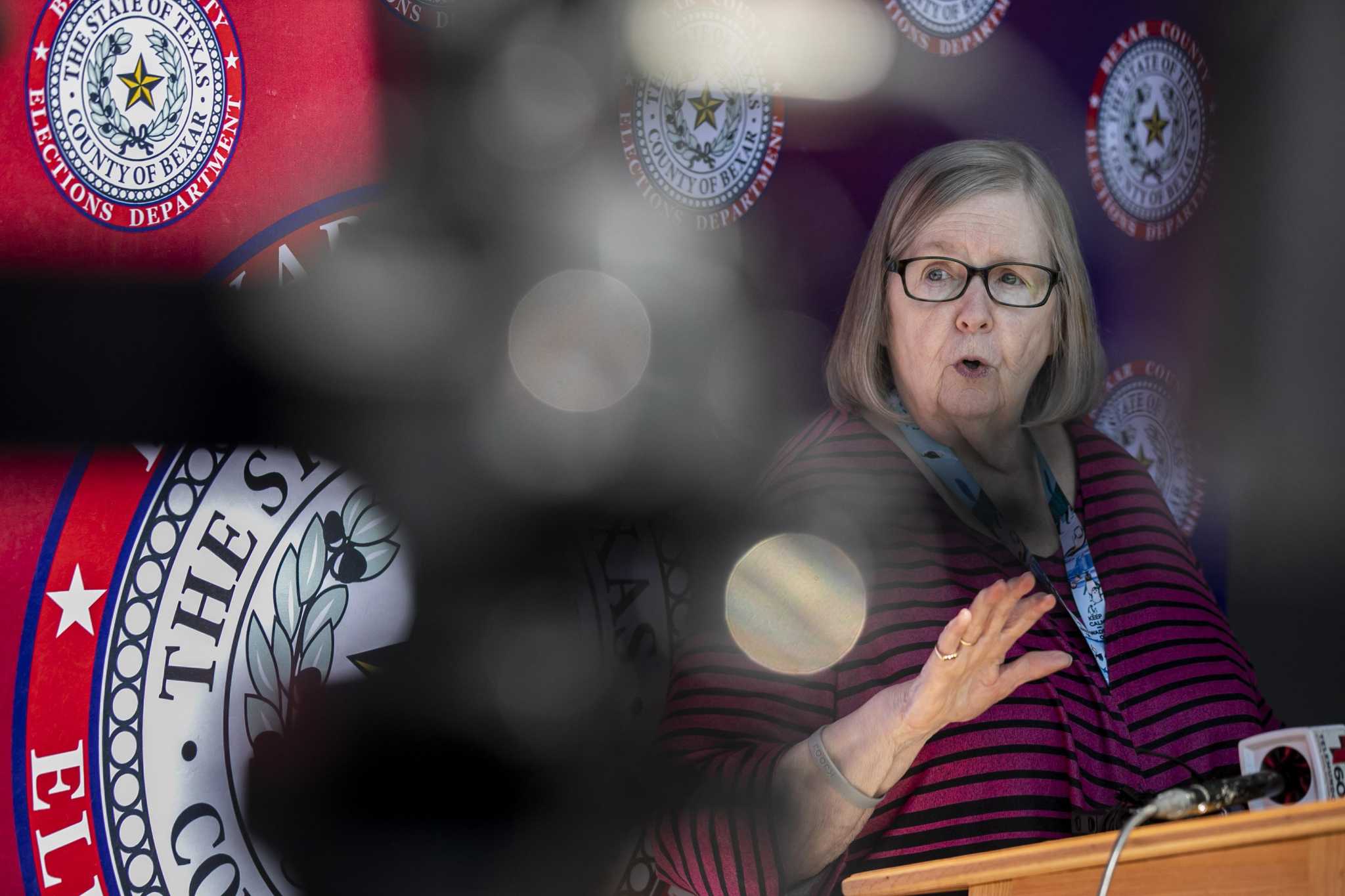 A poll watcher with a gun trailed Bexar County elections chief in 2022