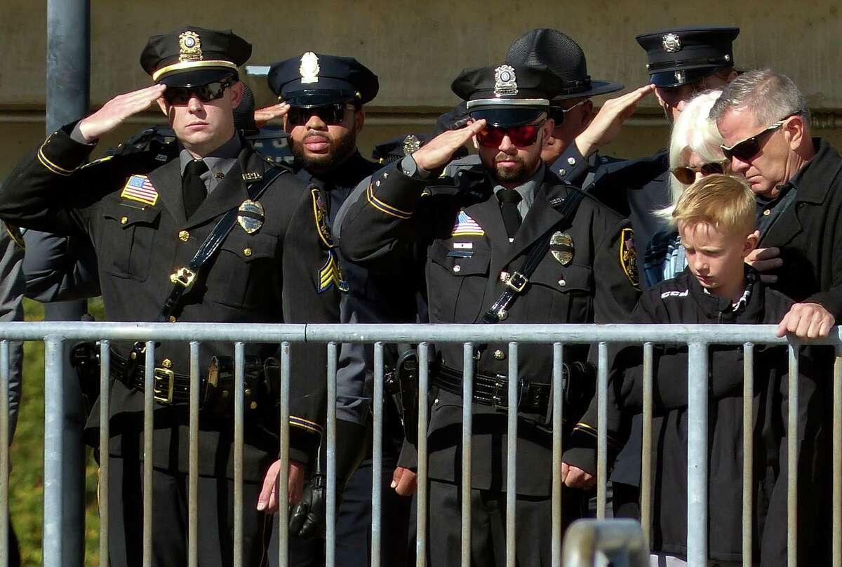 Bristol police funeral draws thousands in East Hartford