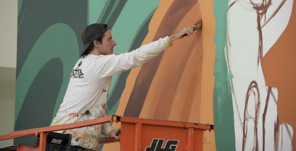 Kiptoe painting 1,800 square-foot mural at Danbury Fair Mall