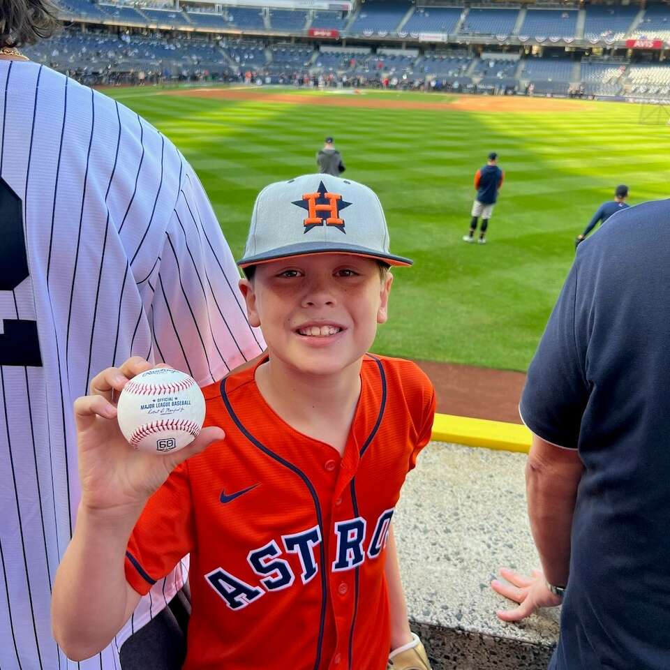 Astros family proudly wears orange in Yankee Stadium's right field