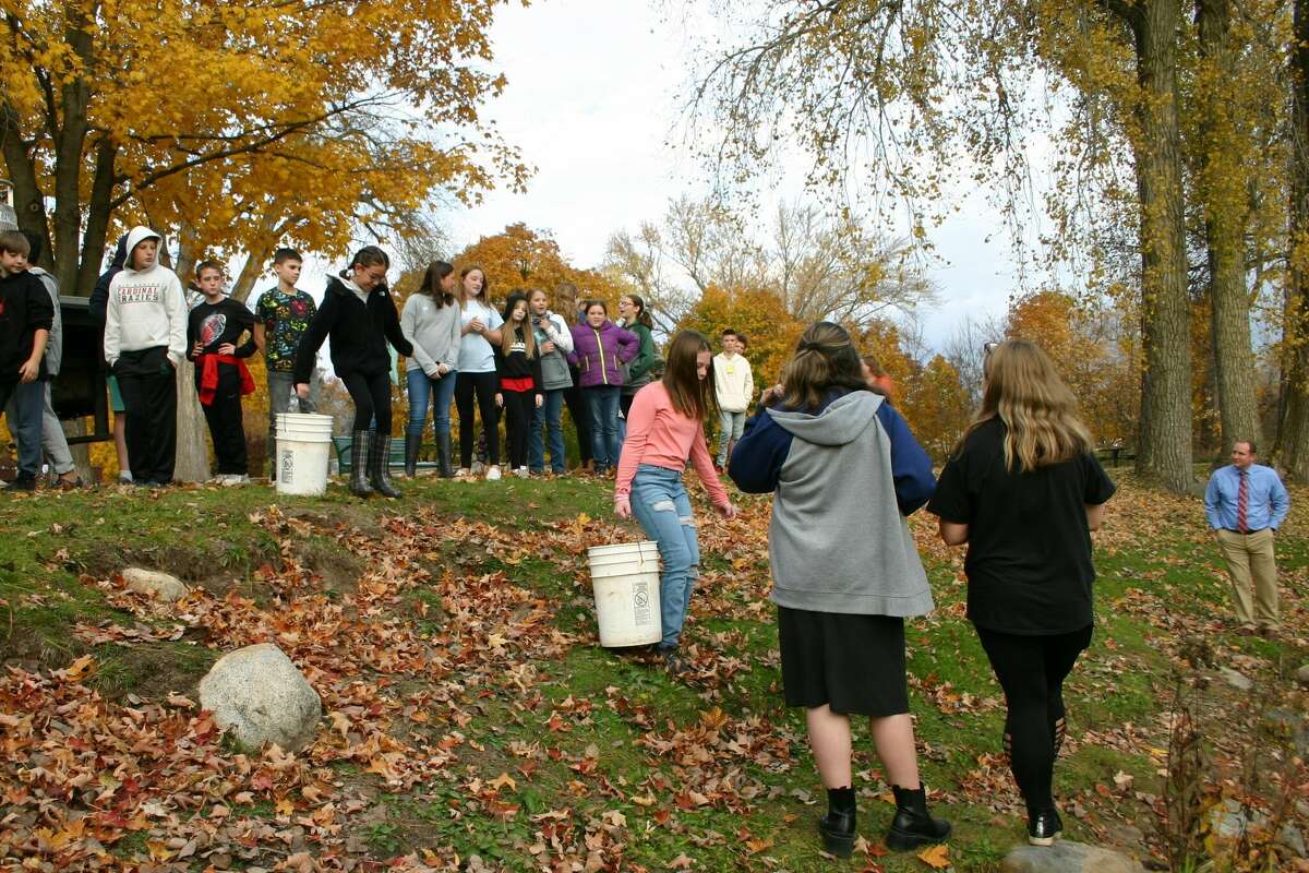 Big Rapids students help restock fish in Muskegon River