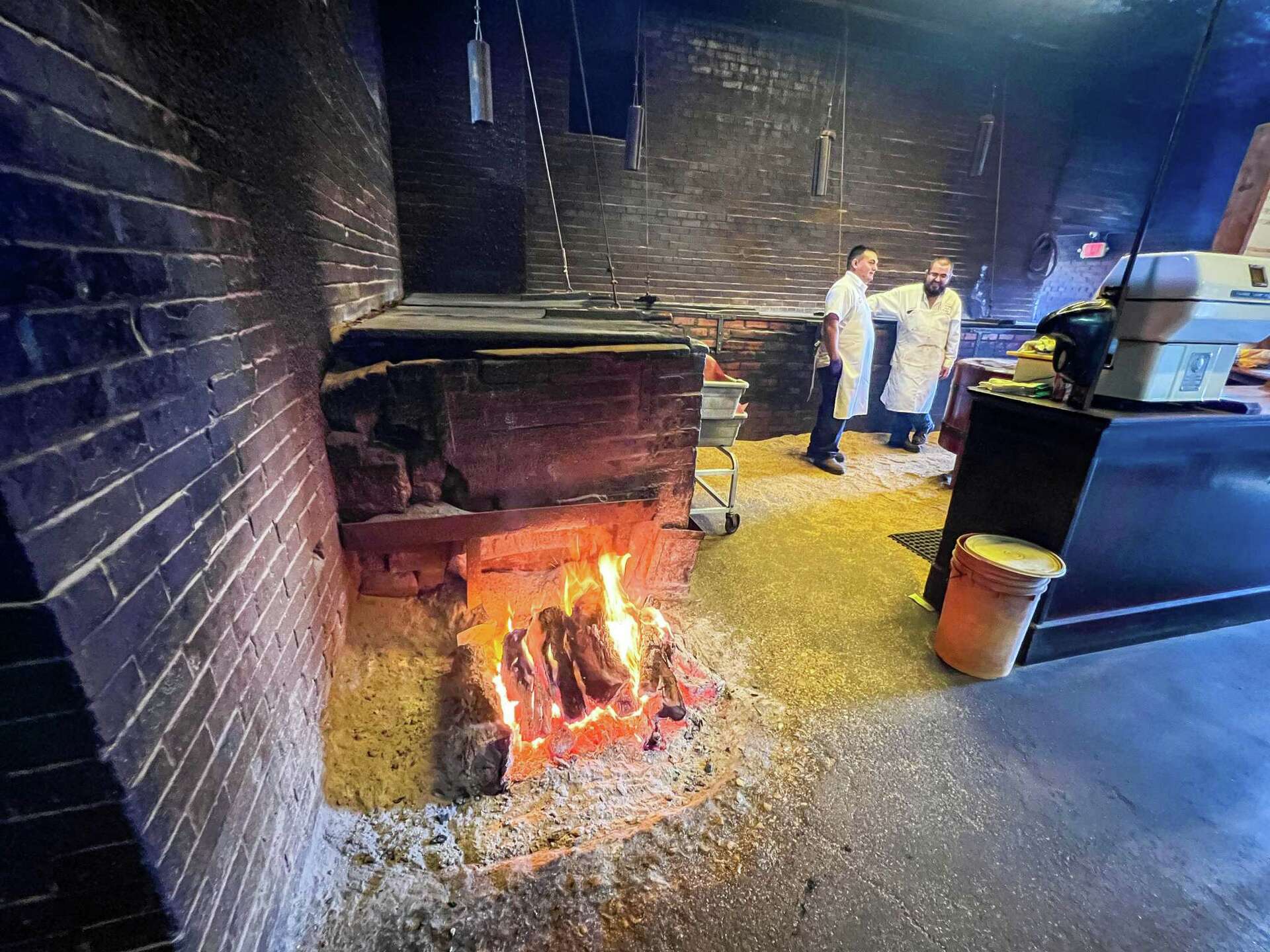 Why did Texas barbecue cooks implement the offset style of pit?