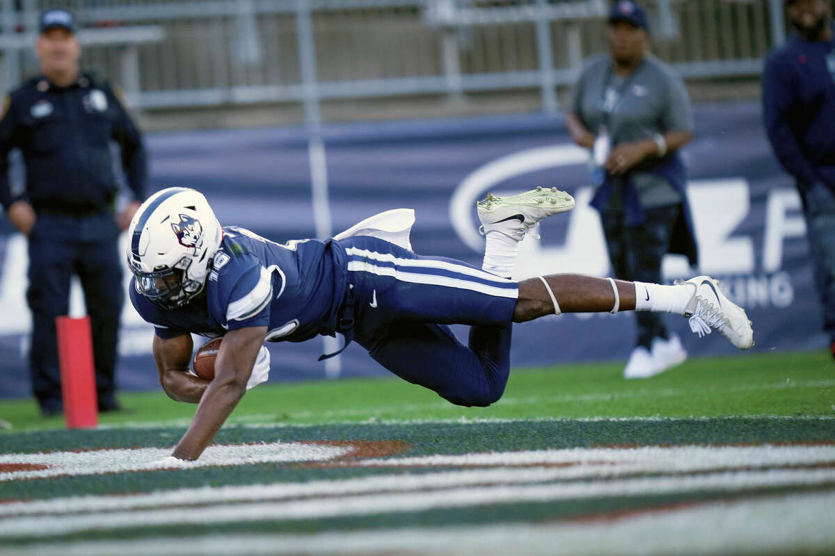 UConn football upsets Liberty for sixth win of season.