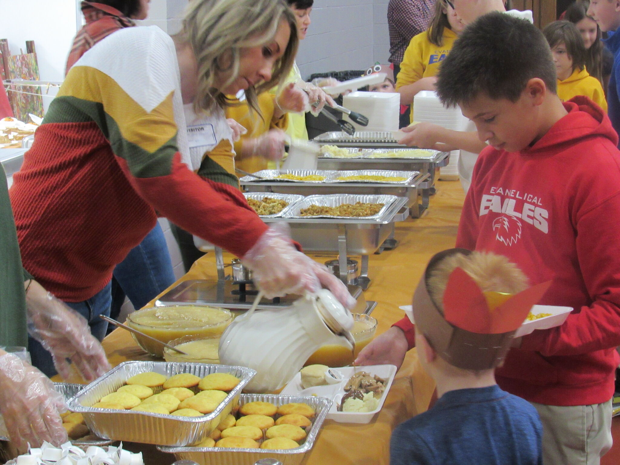 Evangelical School kids enjoy Thanksgiving Feast in Godfrey