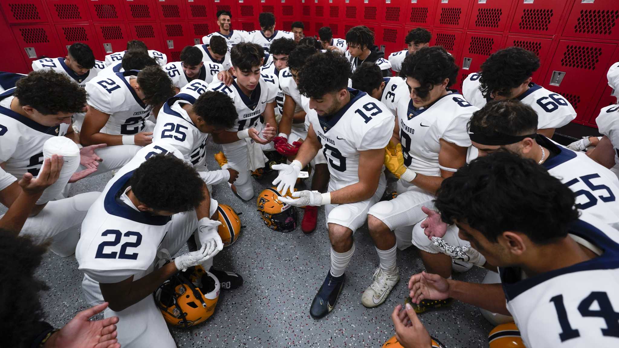 Prayers go on, sometimes out of sight, in prep football