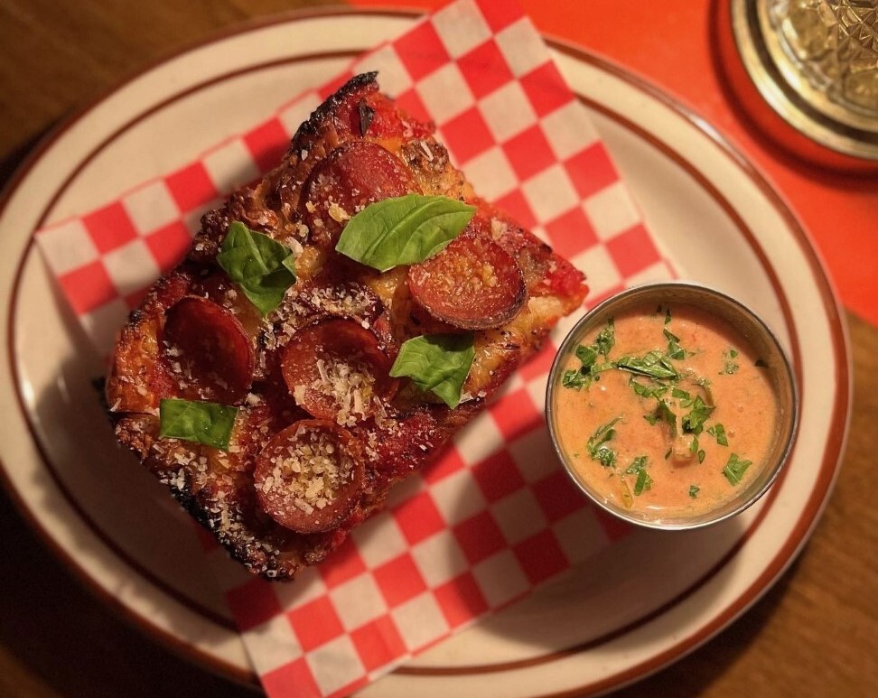 Find Detroit-style pizza in Houston at Tiny Champions