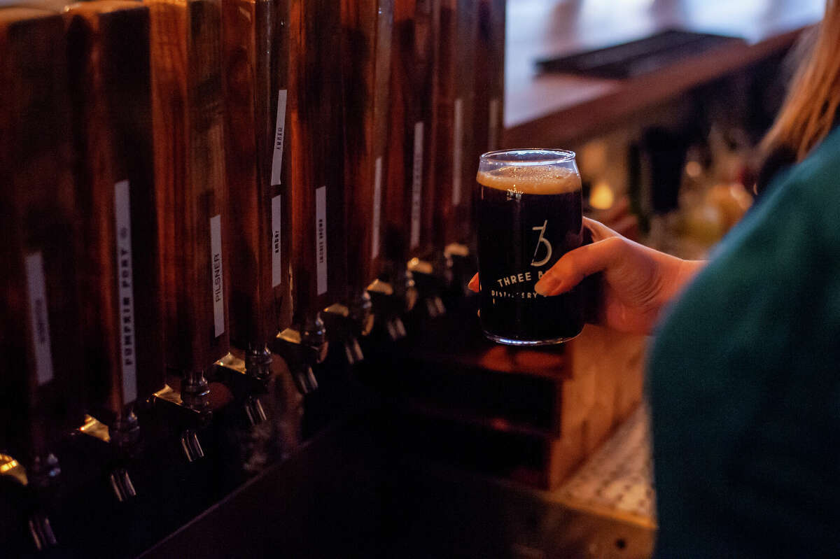 TORI TRIES...shaking things up as a bartender at Three Bridges Distillery