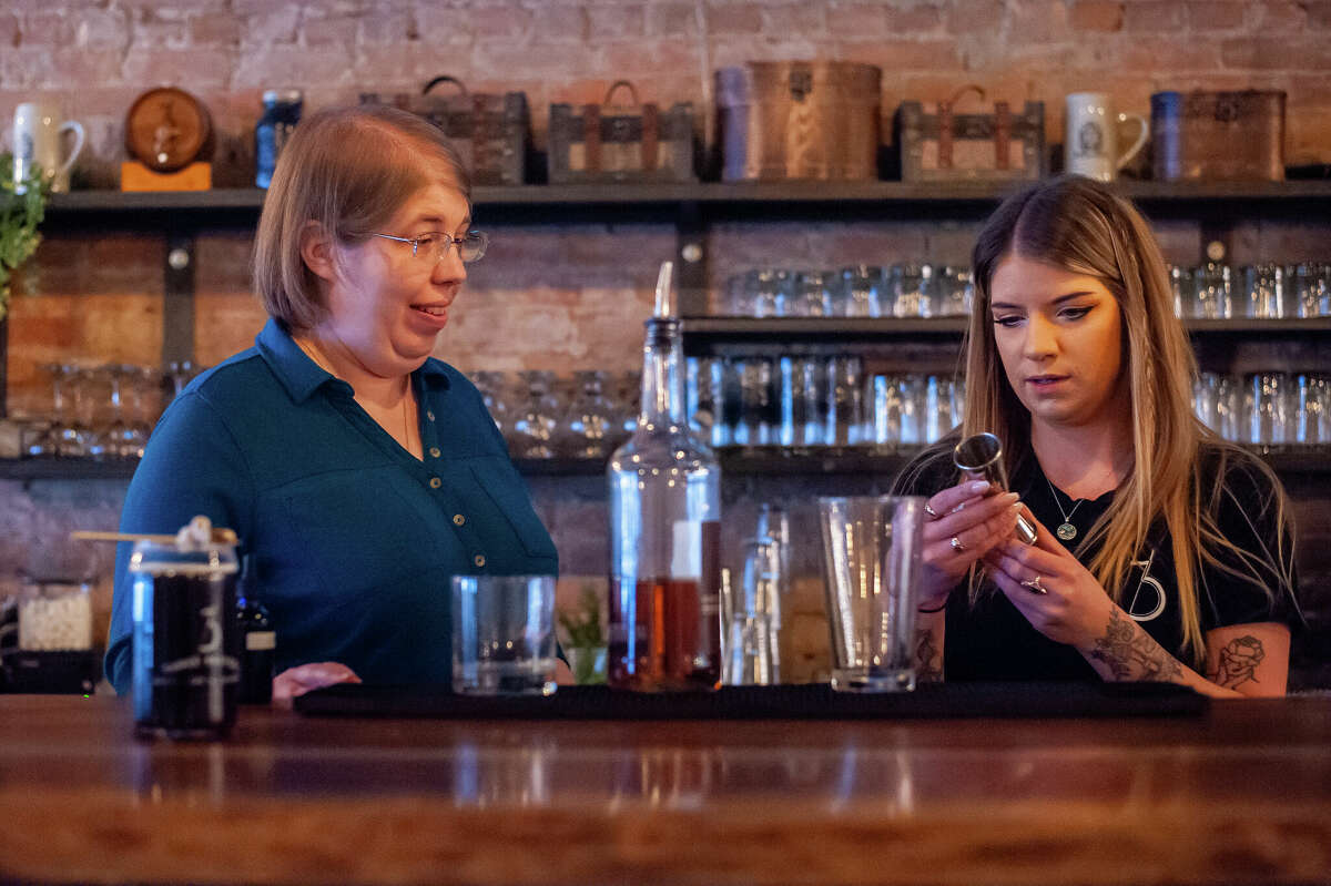 TORI TRIES...shaking things up as a bartender at Three Bridges Distillery