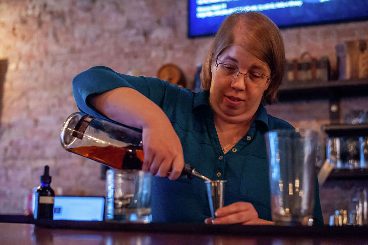 TORI TRIES...shaking things up as a bartender at Three Bridges Distillery
