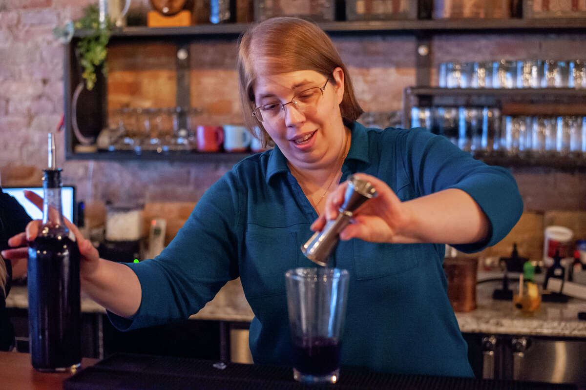 TORI TRIES...shaking things up as a bartender at Three Bridges Distillery