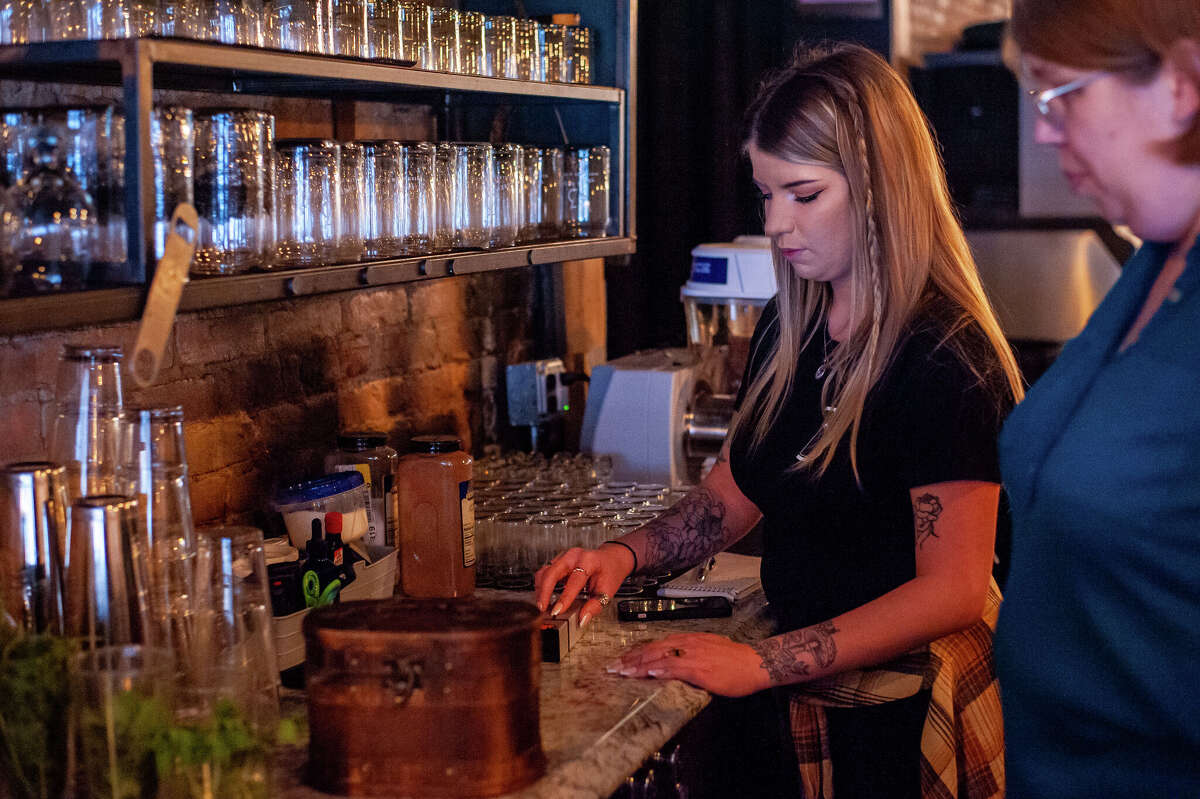 TORI TRIES...shaking things up as a bartender at Three Bridges Distillery