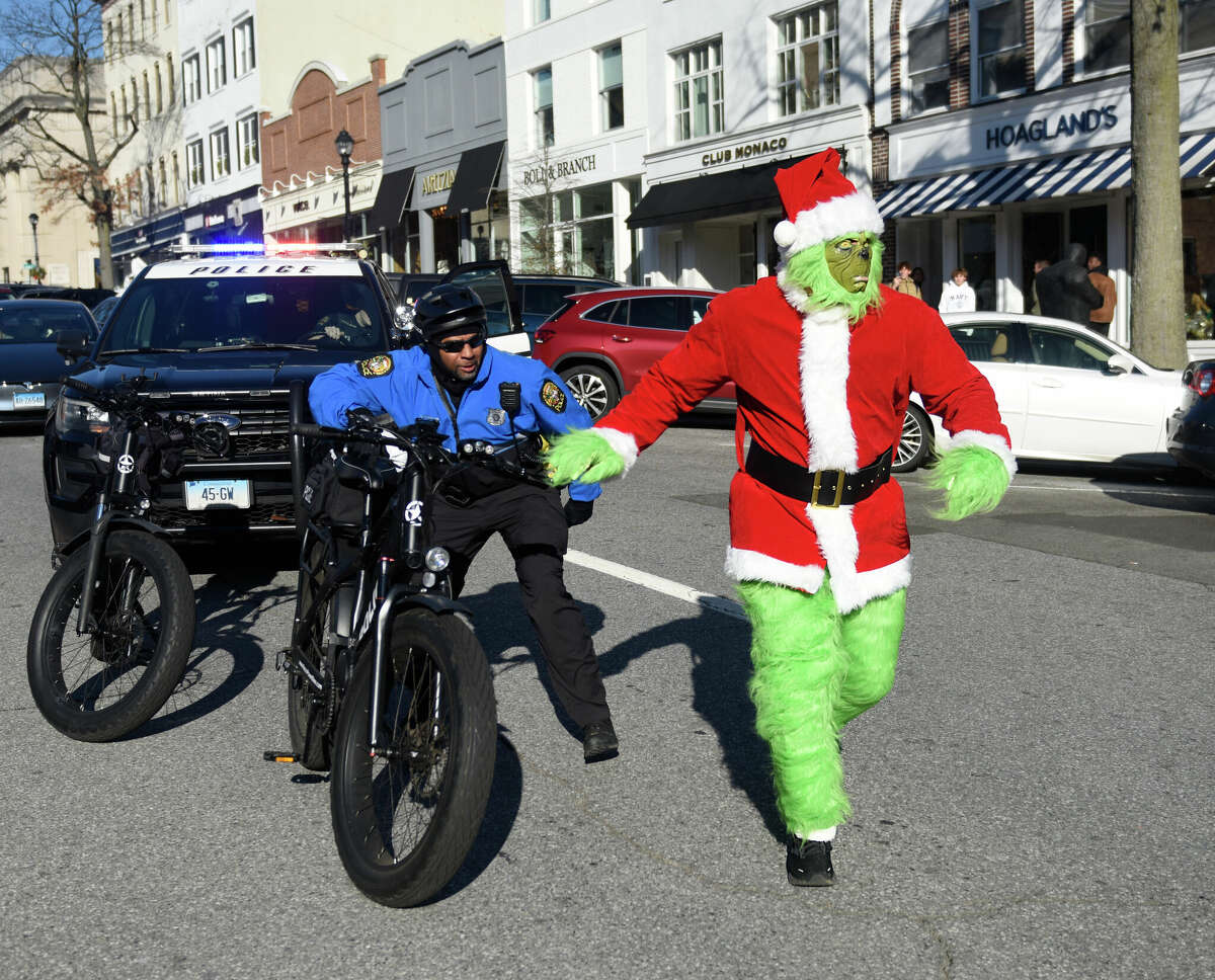 The Grinch 'arrested' on Greenwich Ave. for attempted bike theft