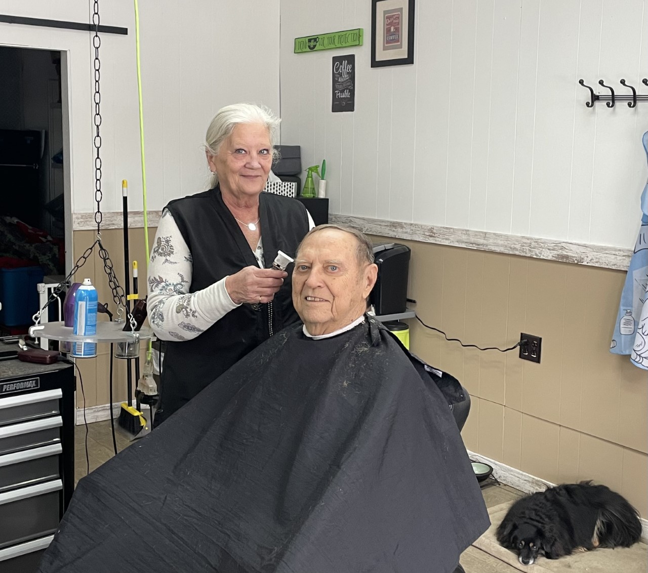 Michigan barber Lorie Barnhart cutting her six year regular's hair