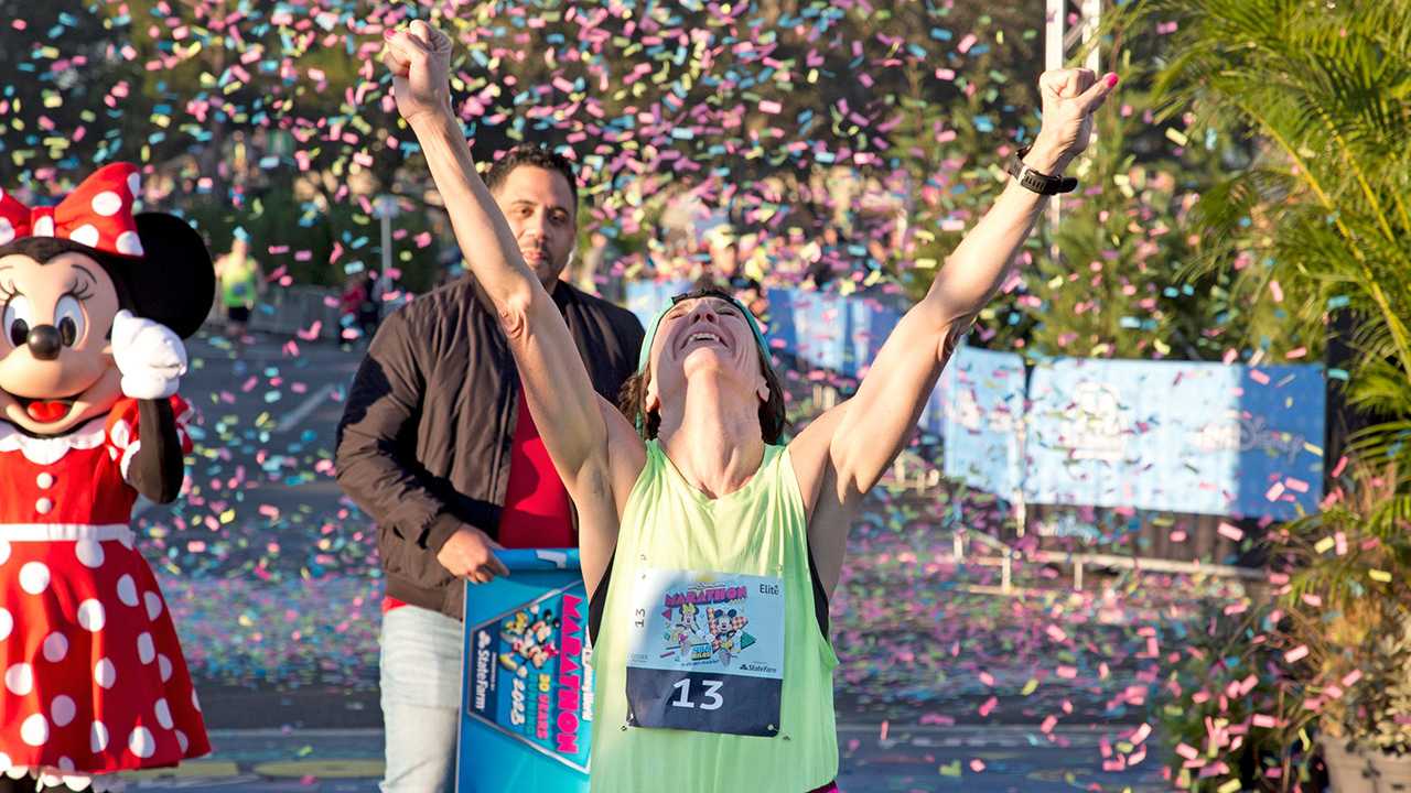 Woman recovering from broken back wins Walt Disney World Marathon