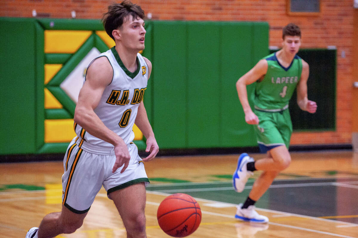 PHOTOS: Dow charges against Lapeer in boys basketball