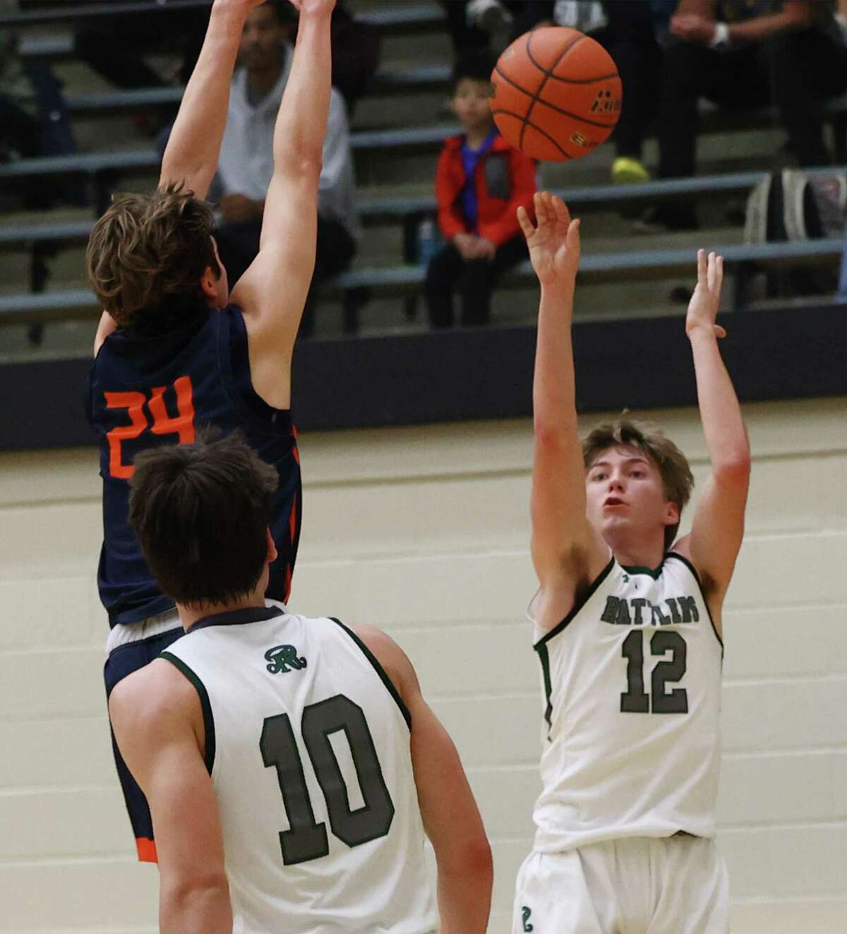 Boys basketball: Reagan stays in command in 28-6A