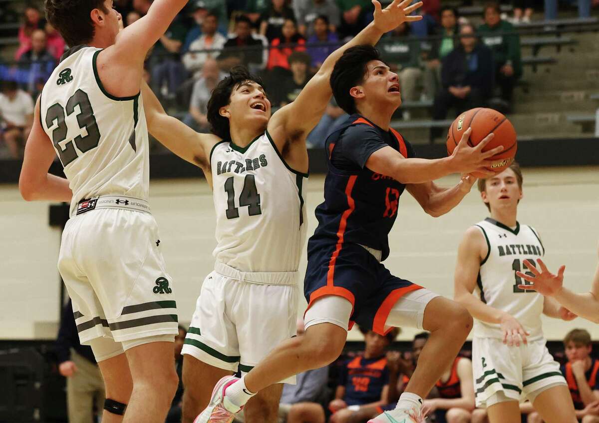 Boys basketball: Reagan stays in command in 28-6A