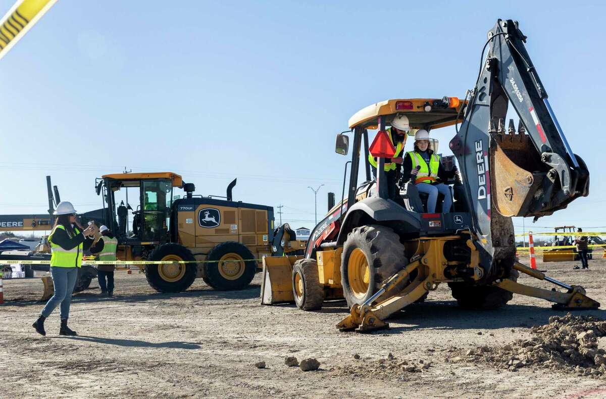 High school students get hands-on experience with heavy equipment