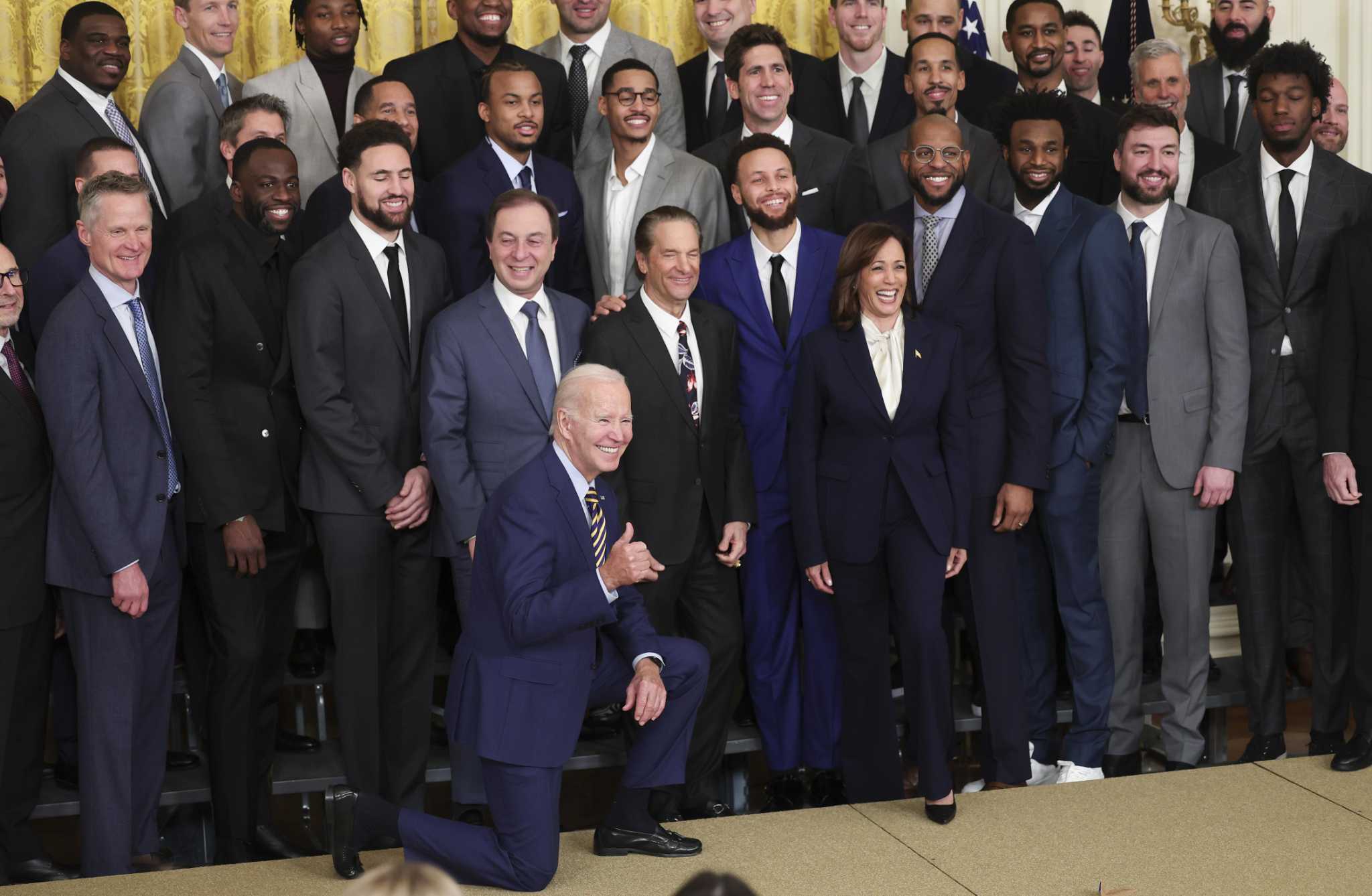 ‘An iconic moment’: In Warriors’ return to White House, Biden takes a knee