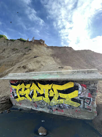 Photos shows WWII bunker on cliff's edge before it fell on SF beach